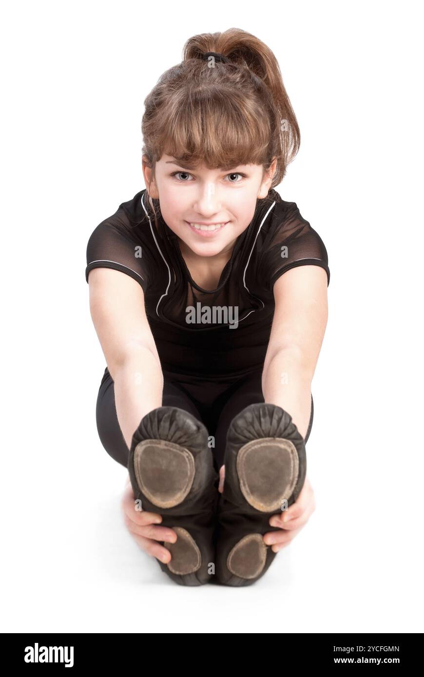 Cute teenage girl stretching Stock Photo - Alamy