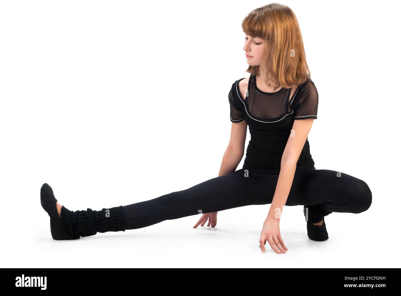 Cute teenage girl stretching Stock Photo - Alamy