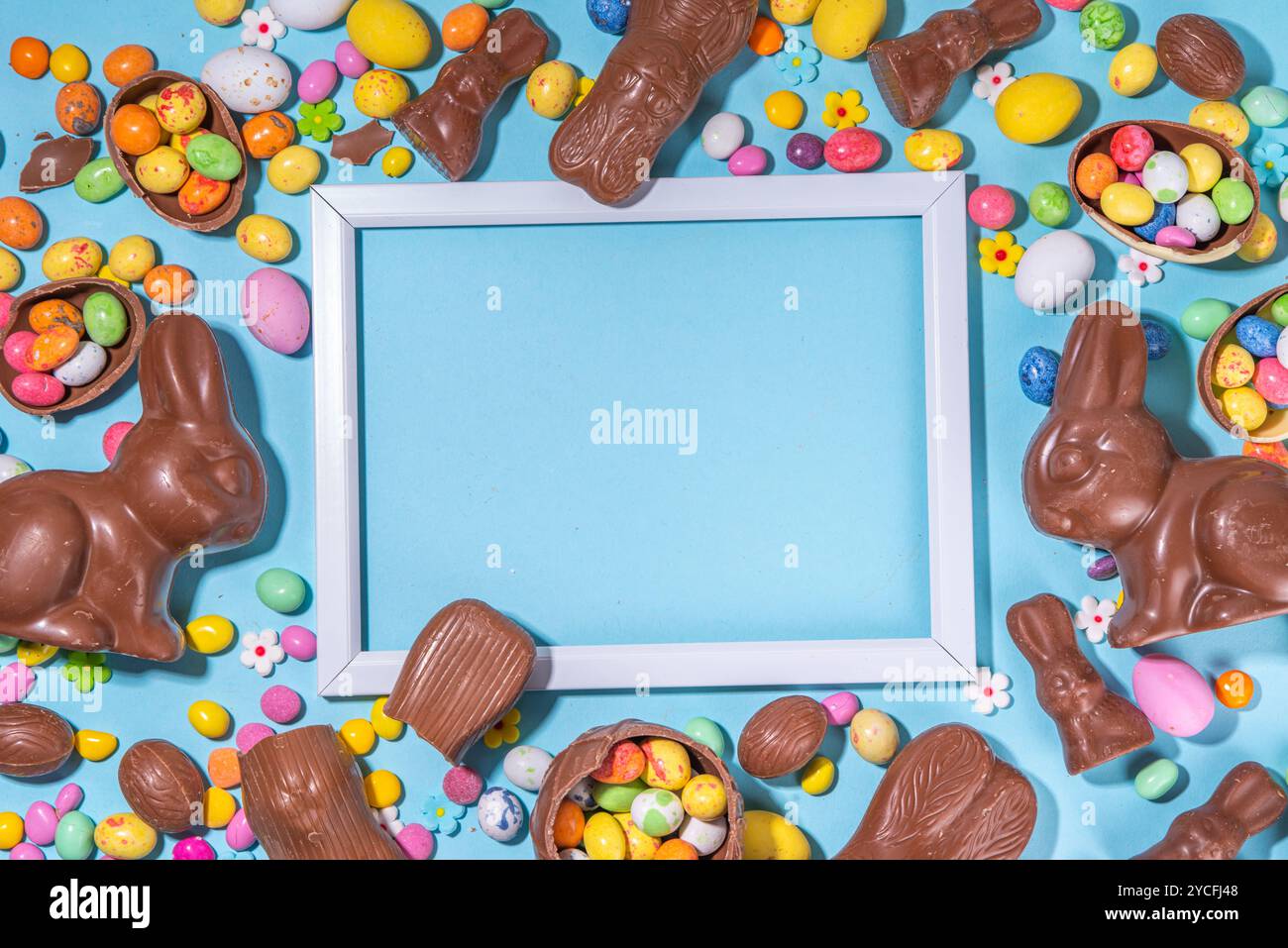 Easter chocolate egg and bunny background. High-colored flat lay with ...