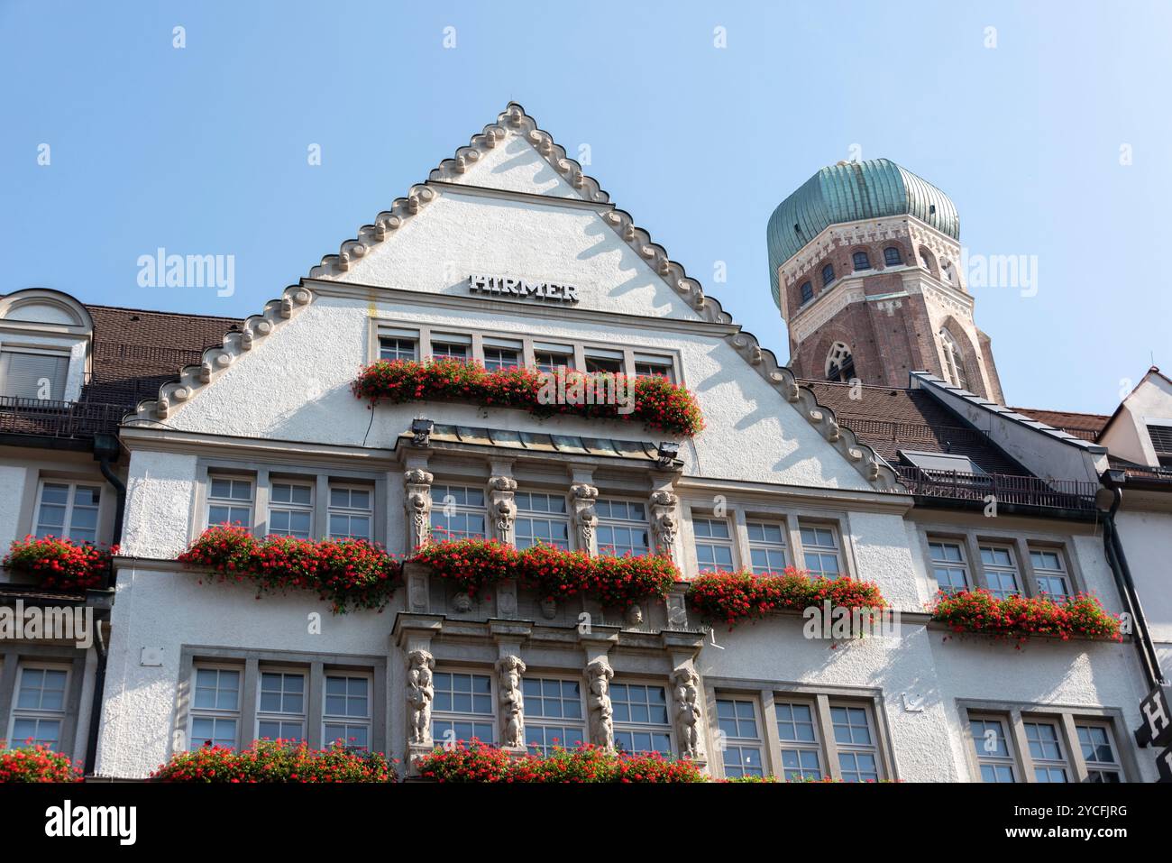 Munich Cathedral, onion dome of the Frauenkirche, in front of Hirmer ...