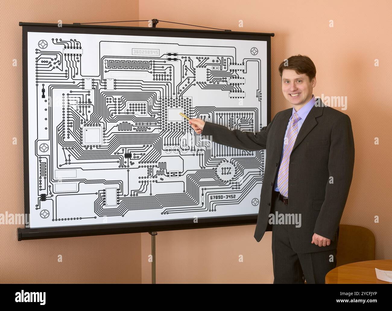 Engineer demonstrates new computer design Stock Photo - Alamy