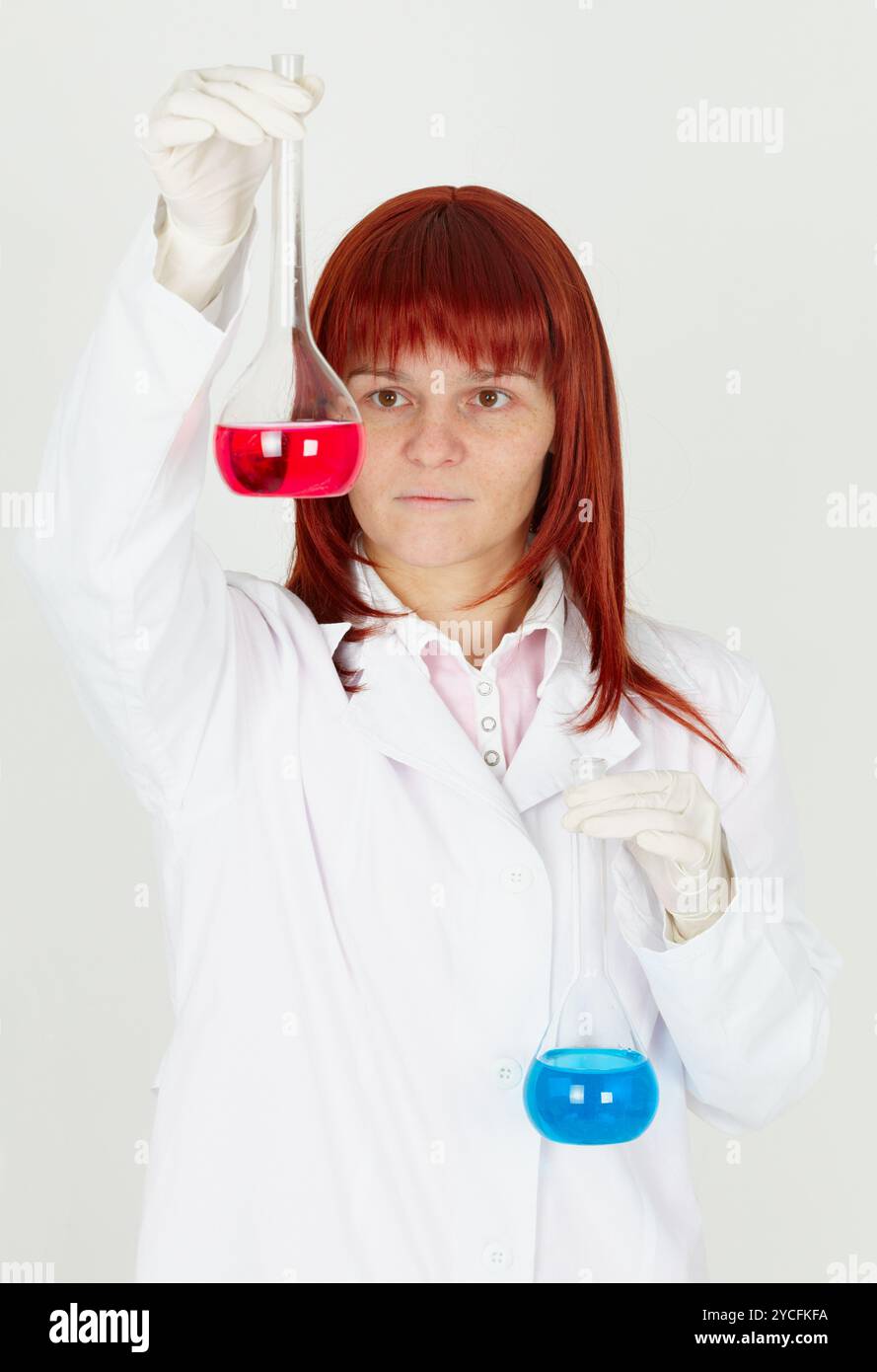 Woman chemist colored flasks hi-res stock photography and images - Alamy