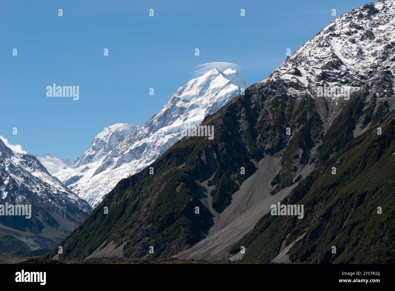 Mt. Cook's peak with rare lenticular cloud directly above Stock Photo ...