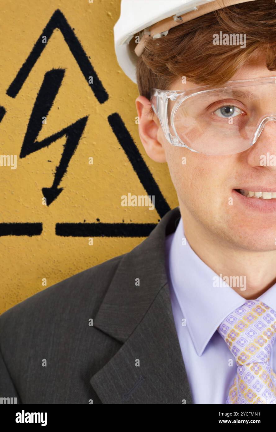 Safety engineer on background of warning signs Stock Photo - Alamy