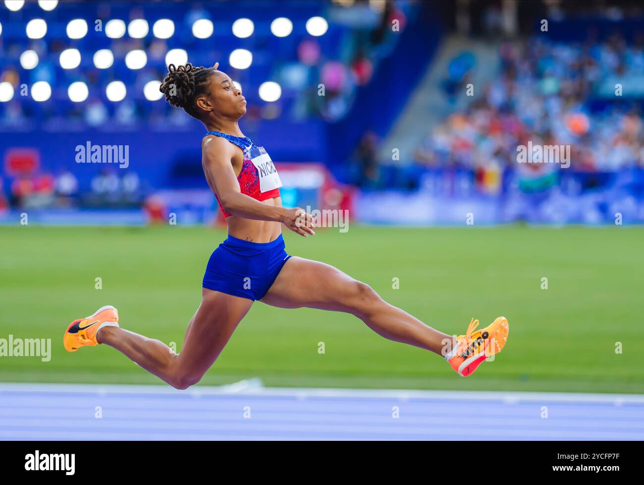 Monae' Nichols participating in the long jump at the Paris 2024 Olympic ...