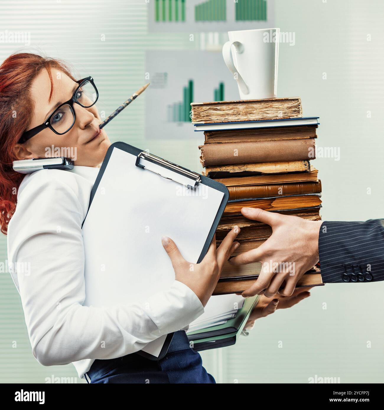 Stressed businesswoman multitasks in office, talking on phone and ...