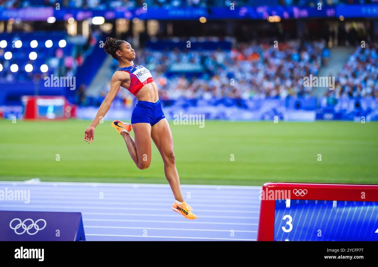 Monae' Nichols participating in the long jump at the Paris 2024 Olympic ...