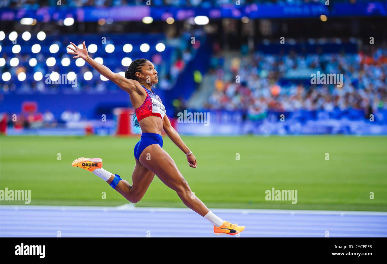Tara Davis-Woodhall participating in the long jump at the Paris 2024 ...