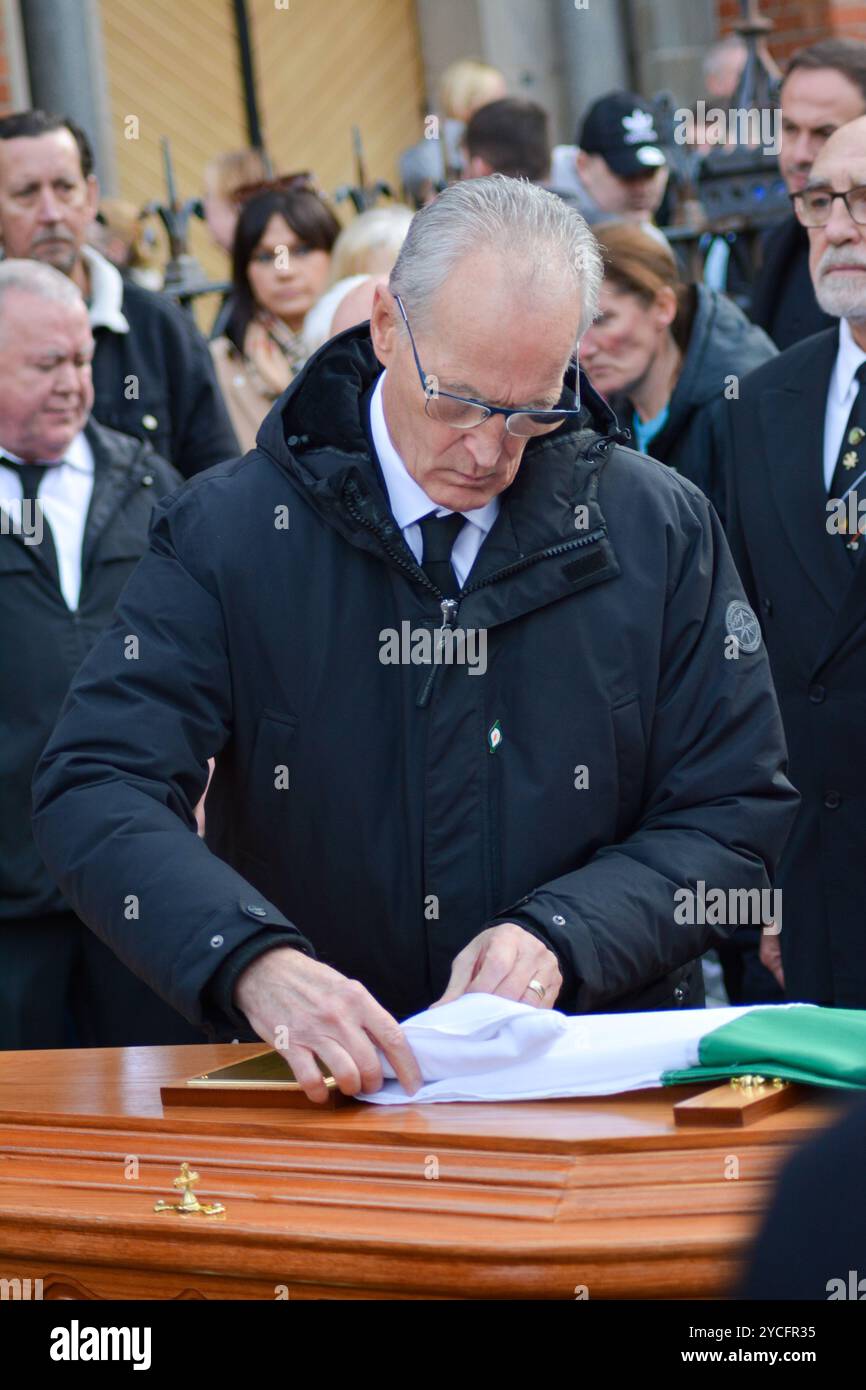 Belfast, United Kingdom 23/10/2024 MLA Gerry Kelly folds an irish ...