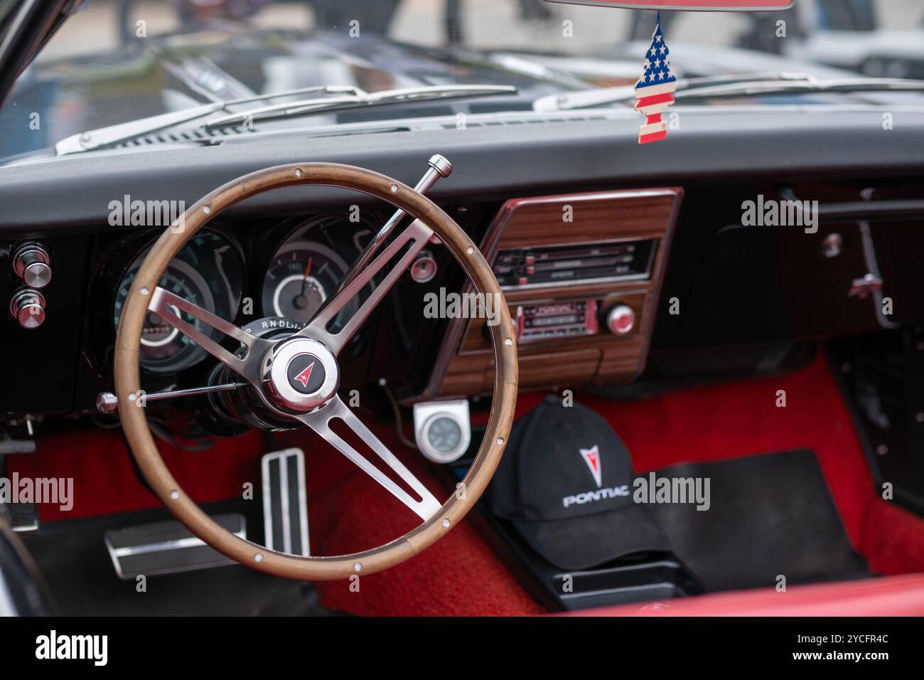 Interior view of a classic Pontiac featuring a stylish steering wheel ...