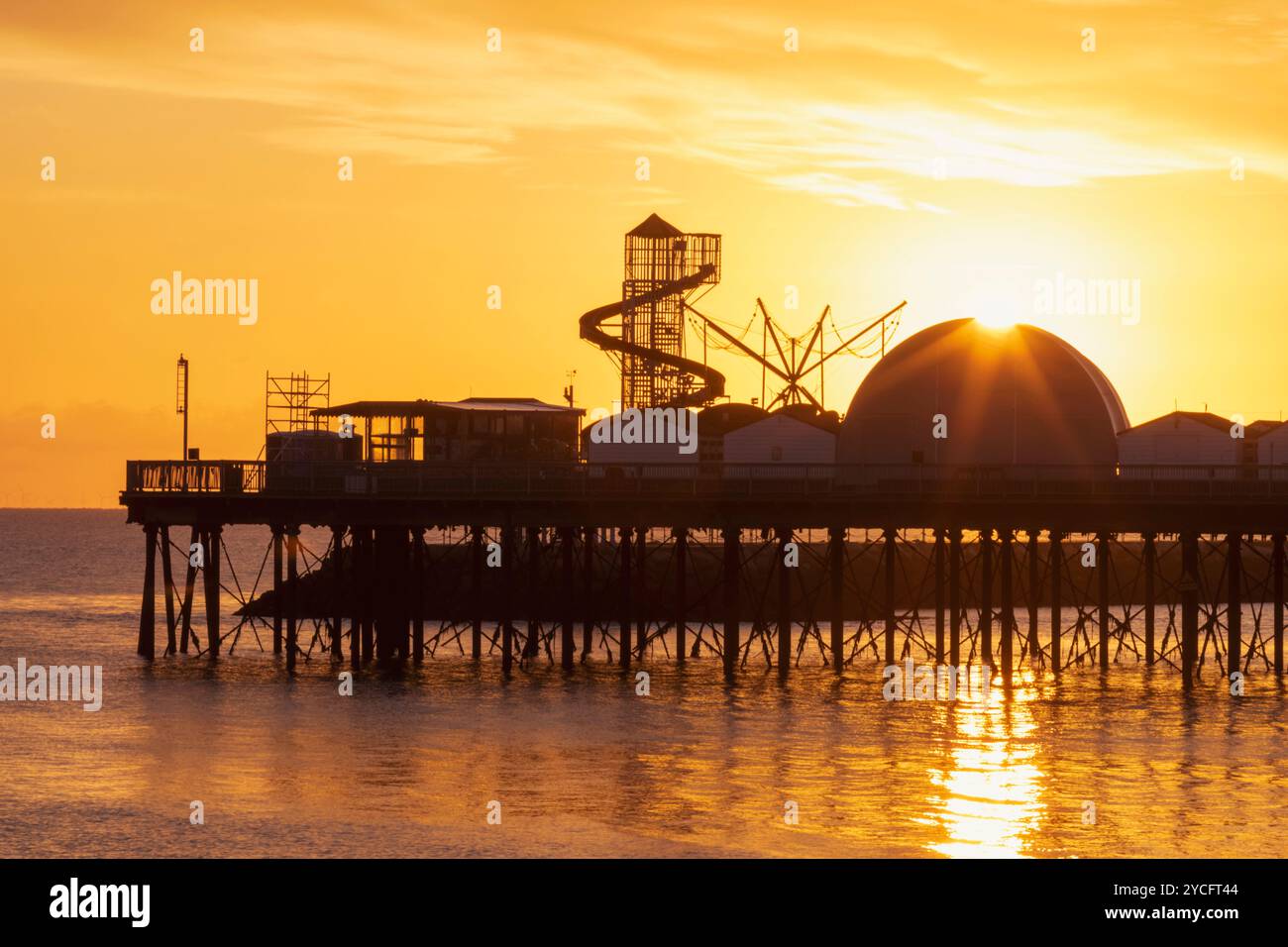 England, Kent, Herne Bay, Sunrise over Sea and Pier in Background Stock ...
