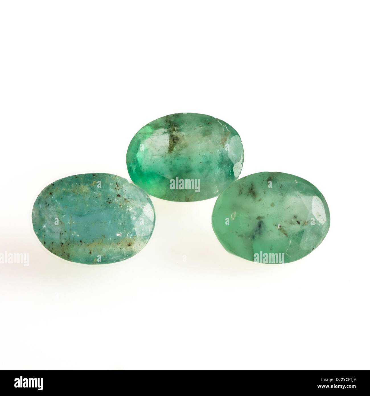 Trio of Brilliantly Faceted Emerald Gemstones with Intricate Inclusions ...
