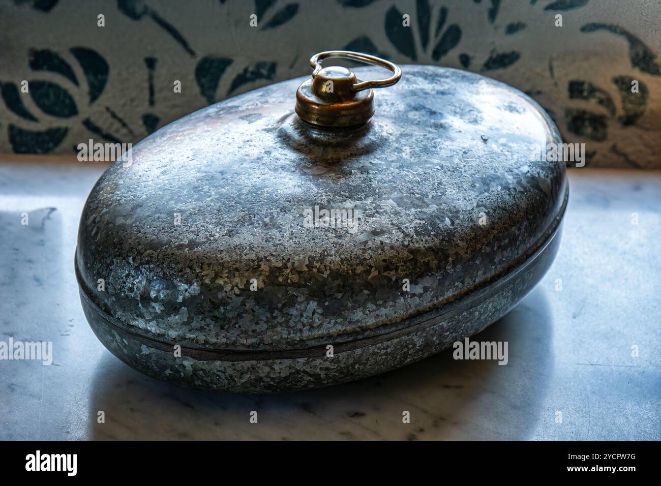 Old zinc hot water bottle with brass cap Stock Photo - Alamy