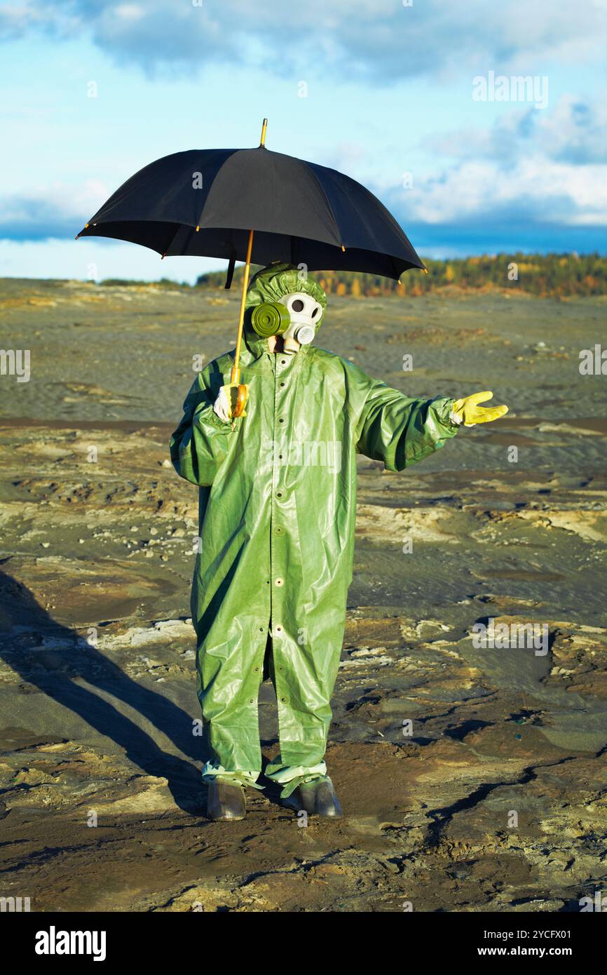 Man in gas mask with umbrella waiting for acid rain Stock Photo - Alamy