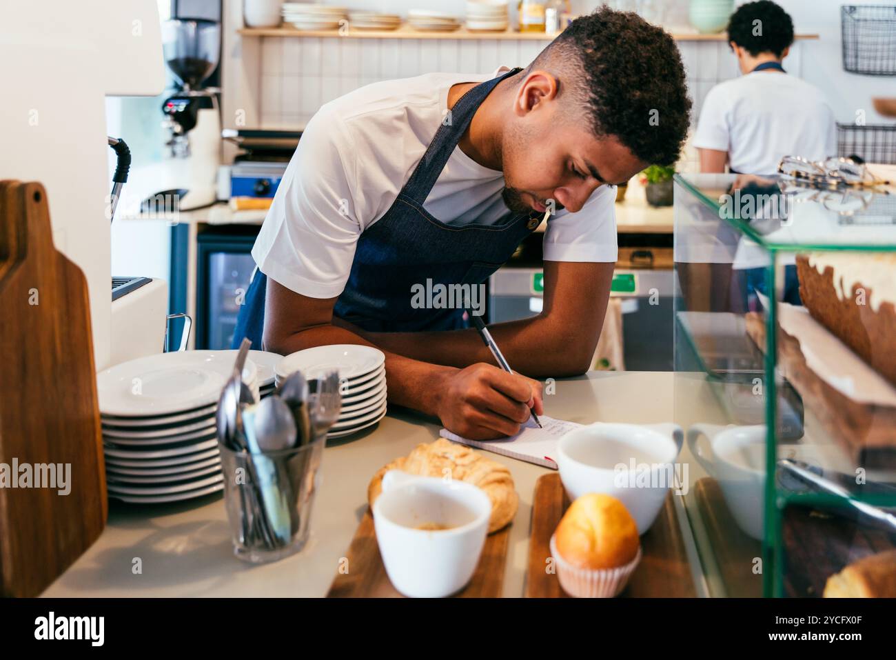 Cappuccino ready drink! waiter man hi-res stock photography and images ...