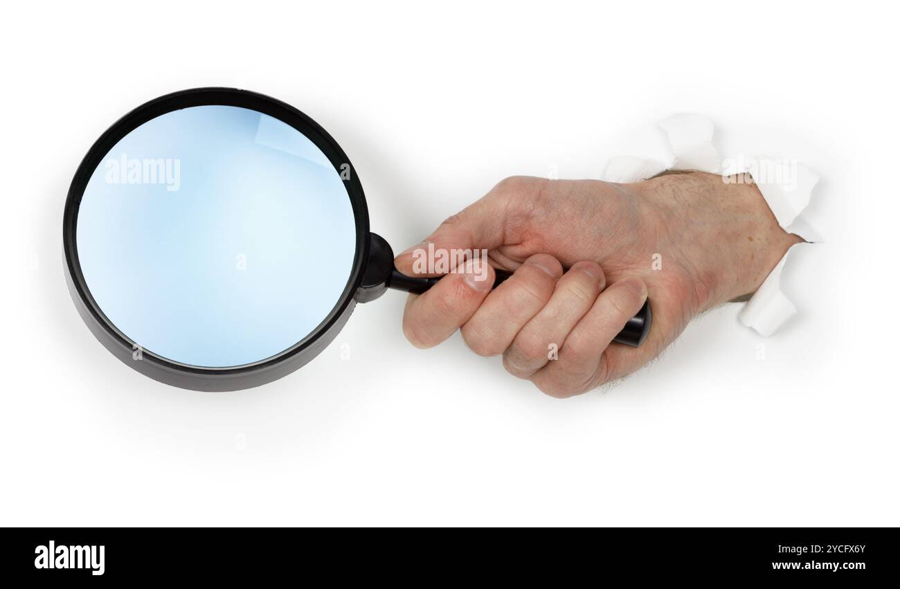 Magnifying glass in hand Stock Photo - Alamy