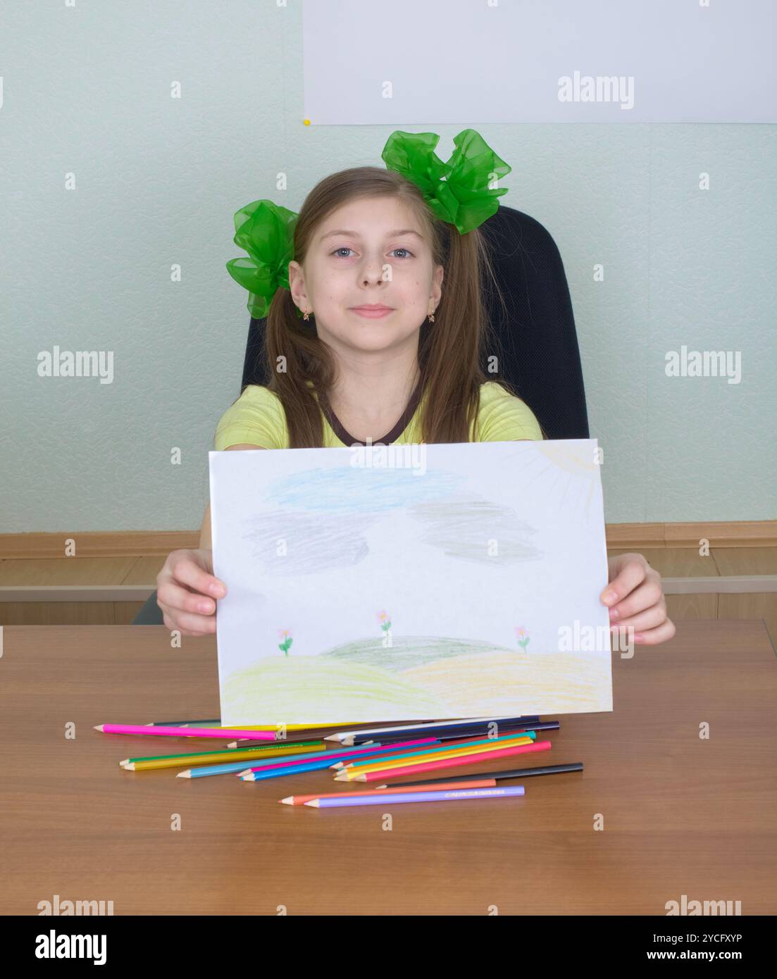 Smiling girl shows new drawing to us Stock Photo - Alamy