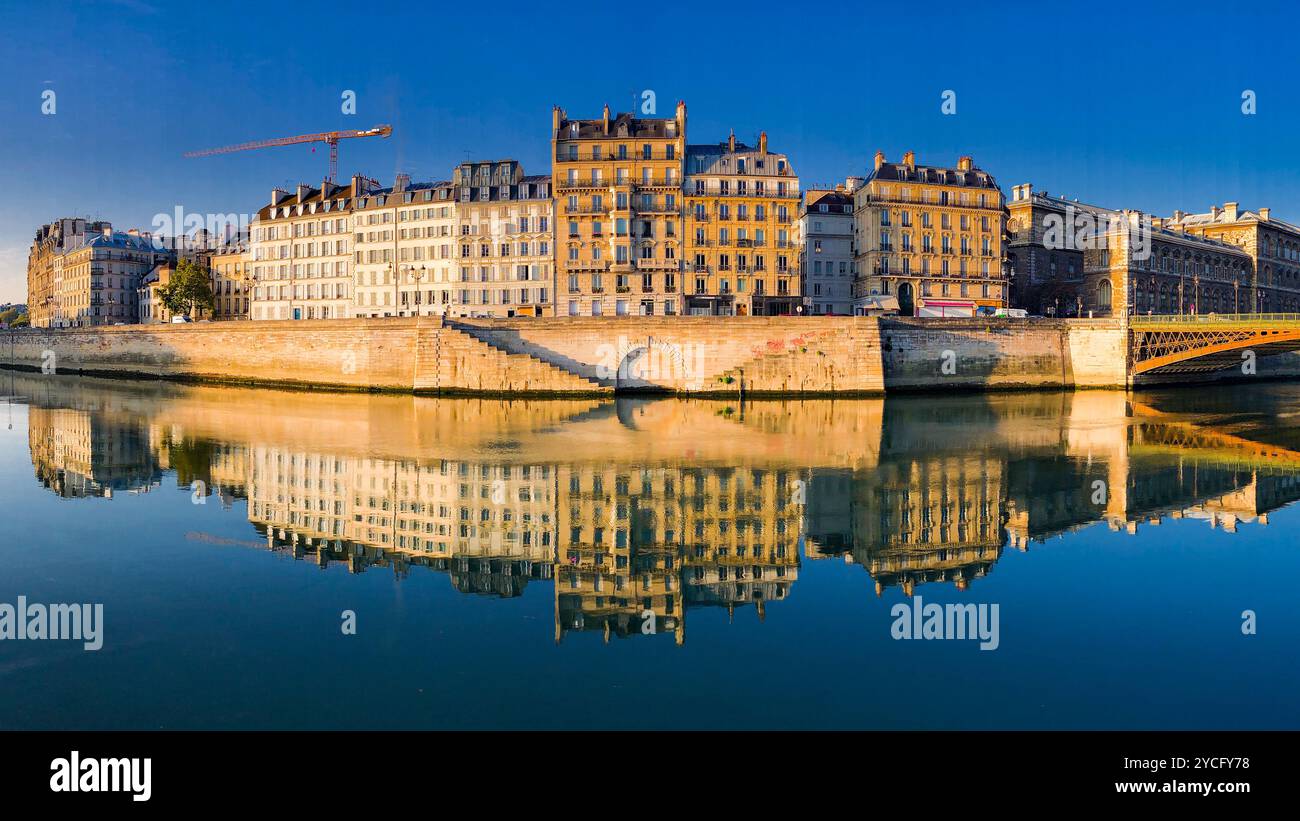 Parisian buildings along the river Seine with reflection on the water ...