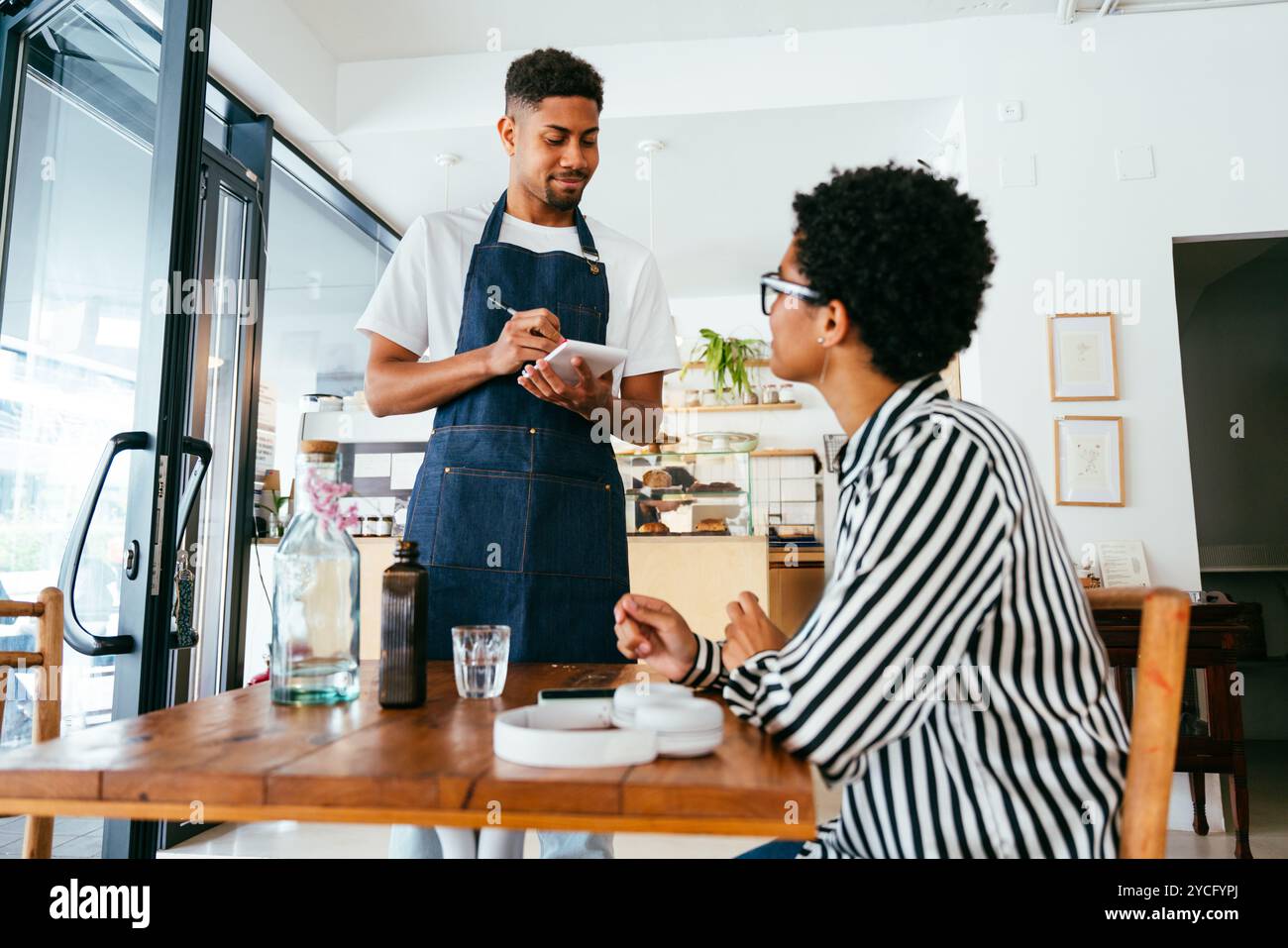 Server waiter barista taking order hi-res stock photography and images ...