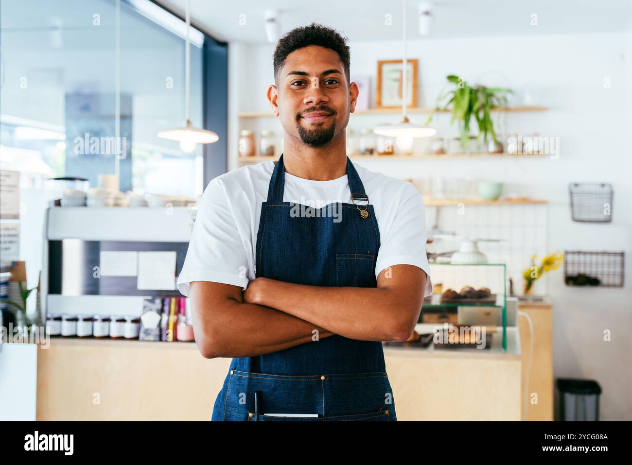 Bakery, happy portrait of hispanic black man in cafe ready for serving ...