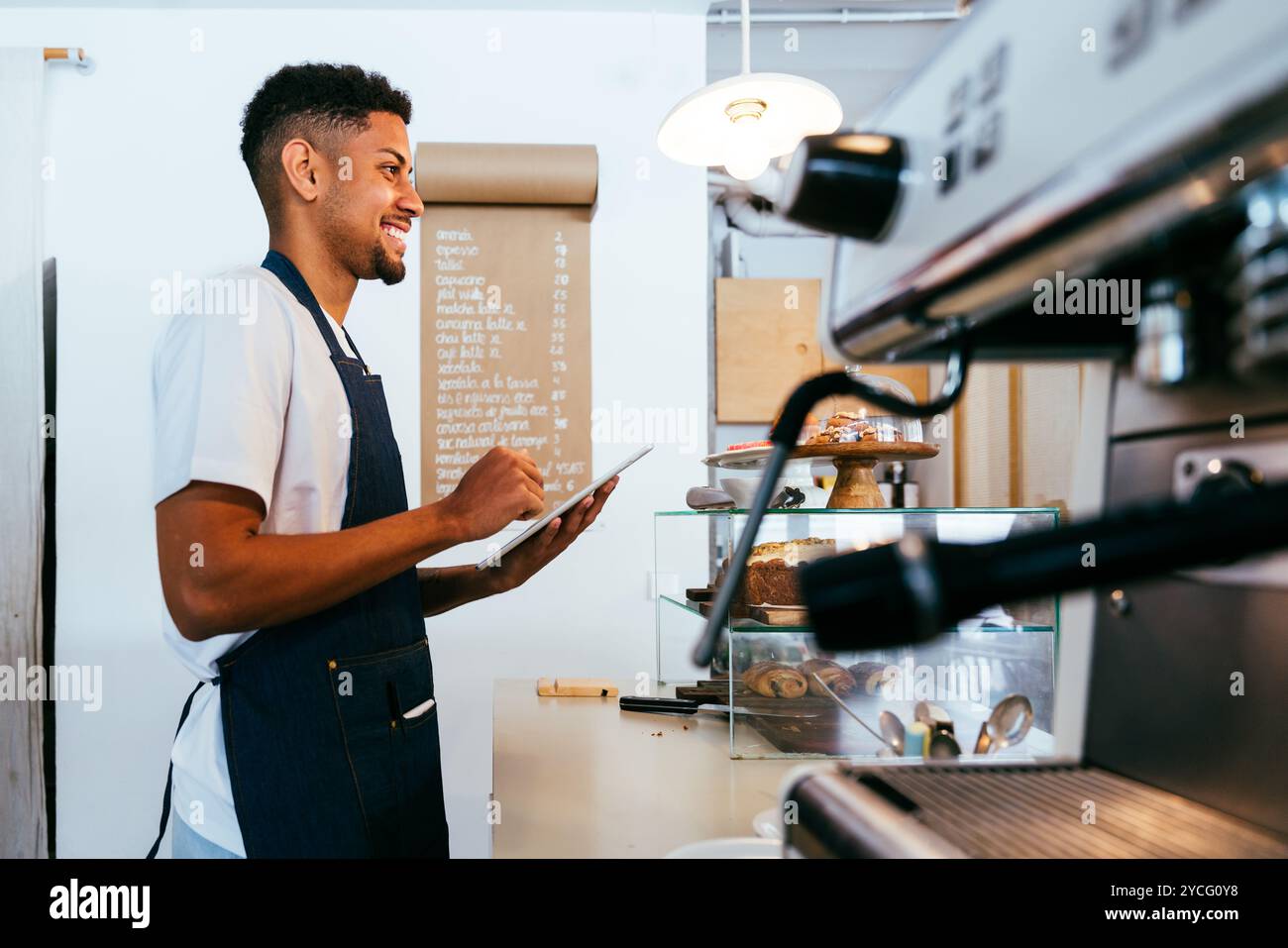 Bakery, happy portrait of hispanic black man in cafe ready for serving ...