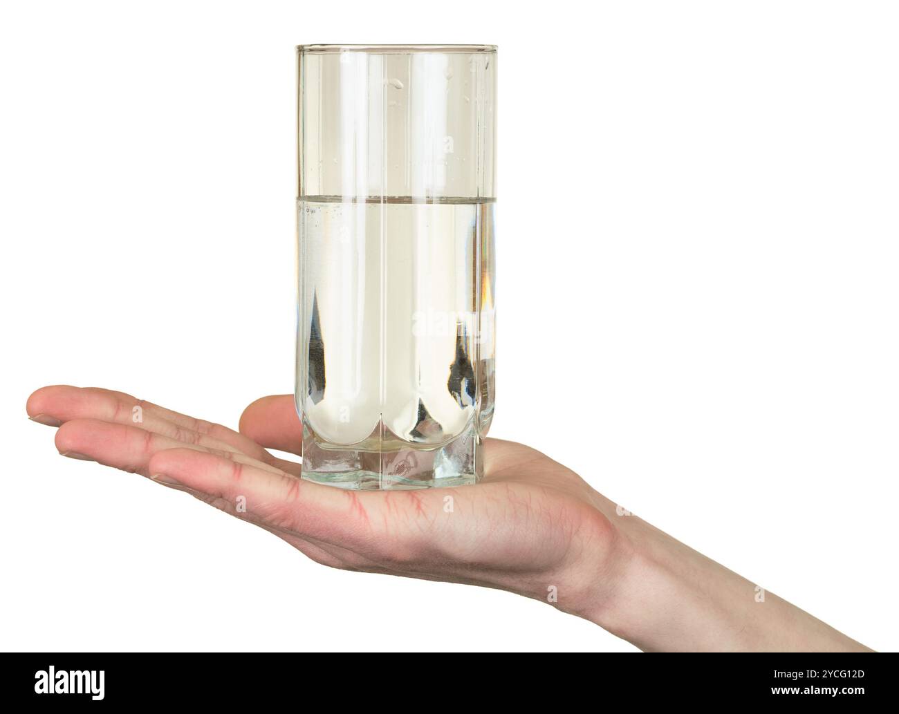Glass of water on hand Stock Photo - Alamy