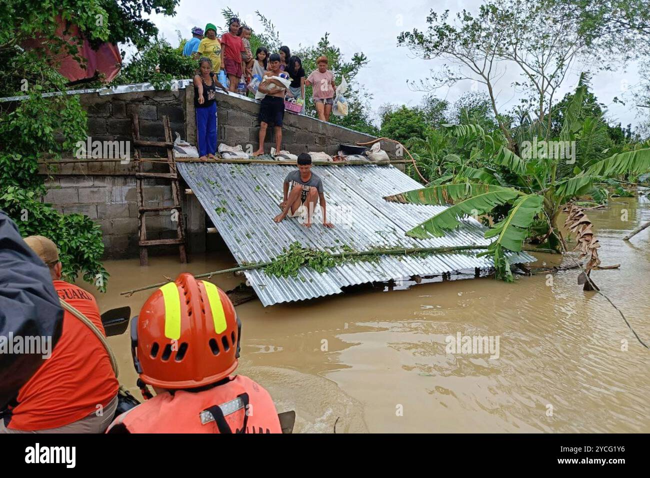 In this photo provided by the Philippine Coast Guard, residents staying ...