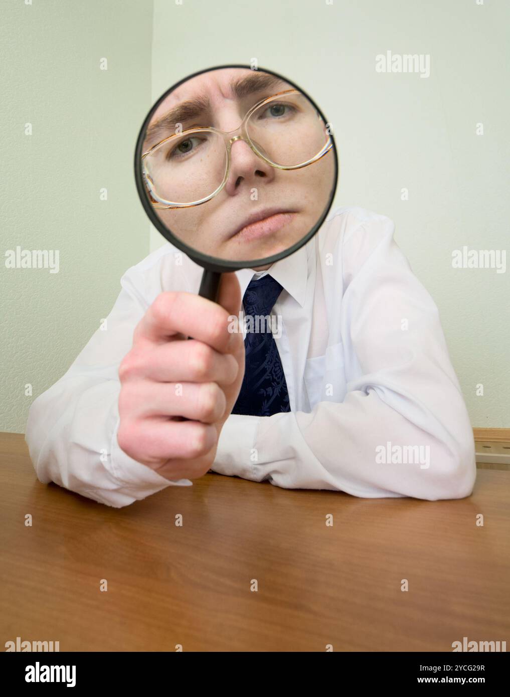 Man in magnifying glasses close hi-res stock photography and images - Alamy