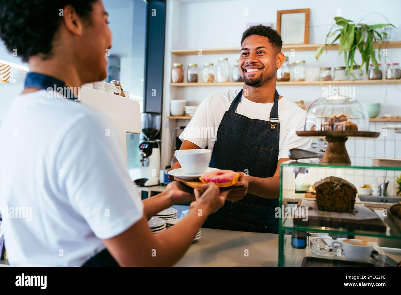 Cappuccino ready drink! waiter man hi-res stock photography and images ...