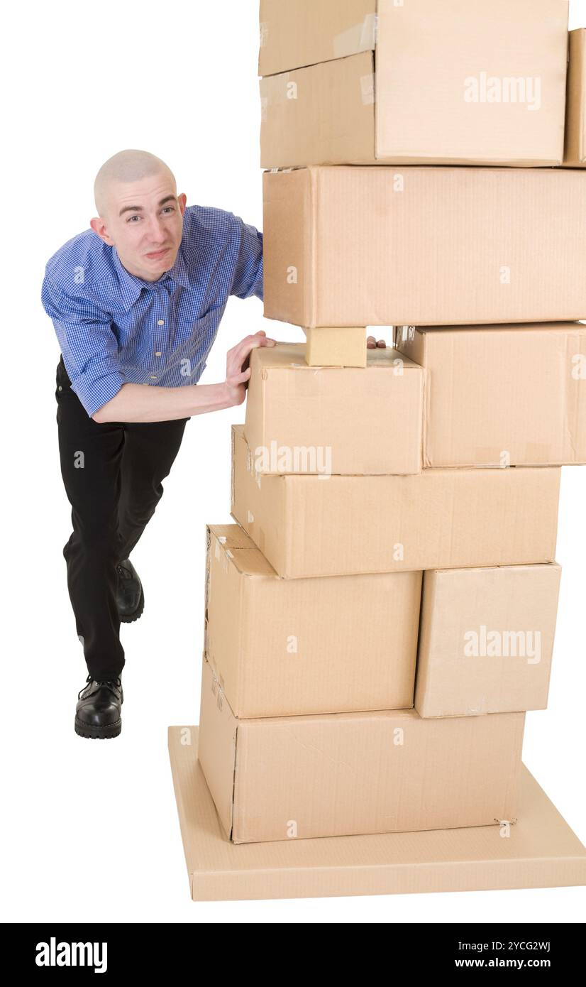 Man pushing heap from cardboard boxes Stock Photo - Alamy