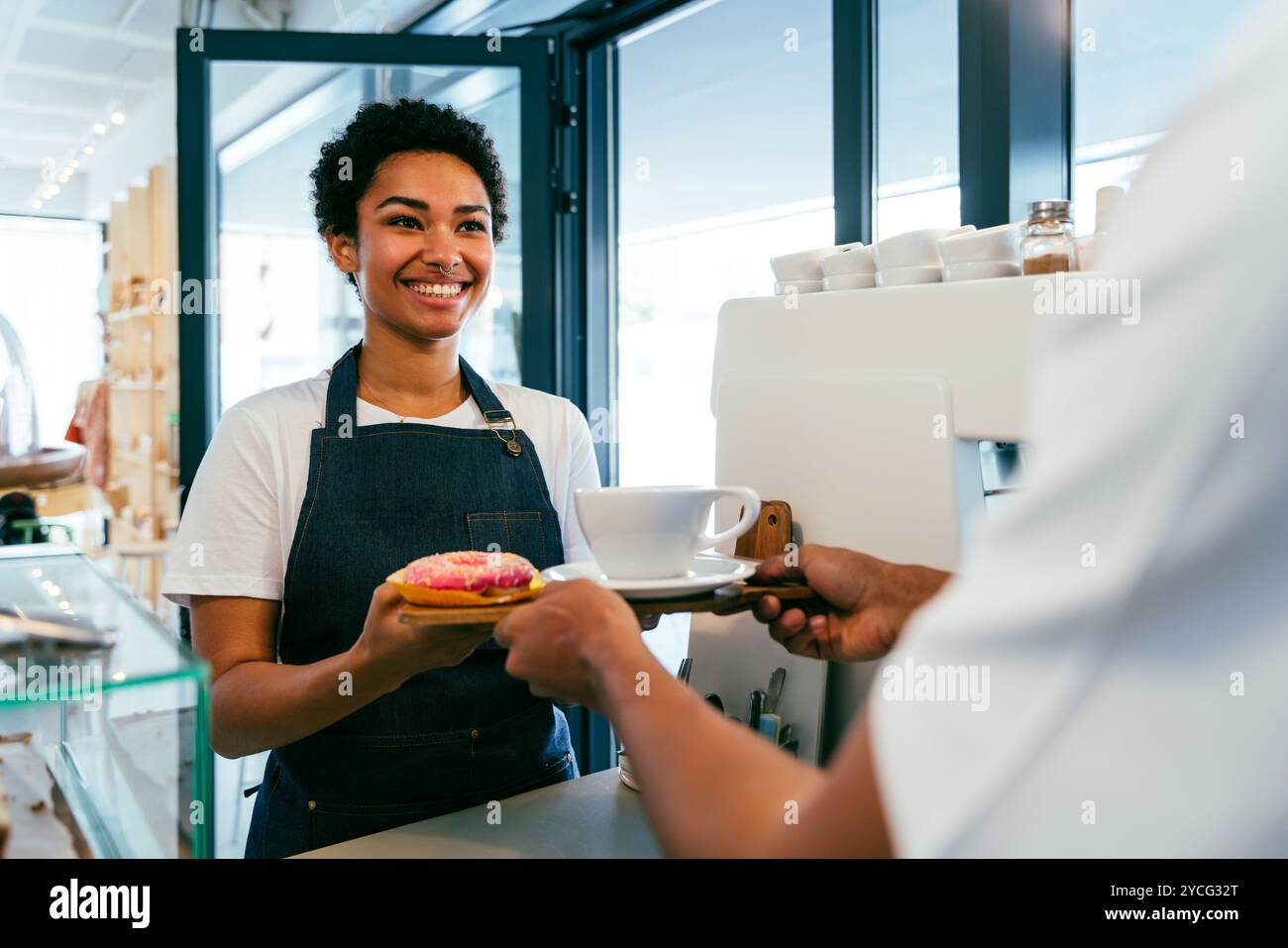 Cappuccino ready drink! waiter man hi-res stock photography and images ...