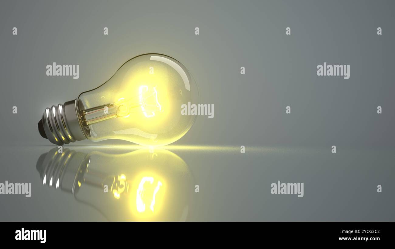 Glowing Lightbulb Grey Background A glowing lightbulb on the grey ...