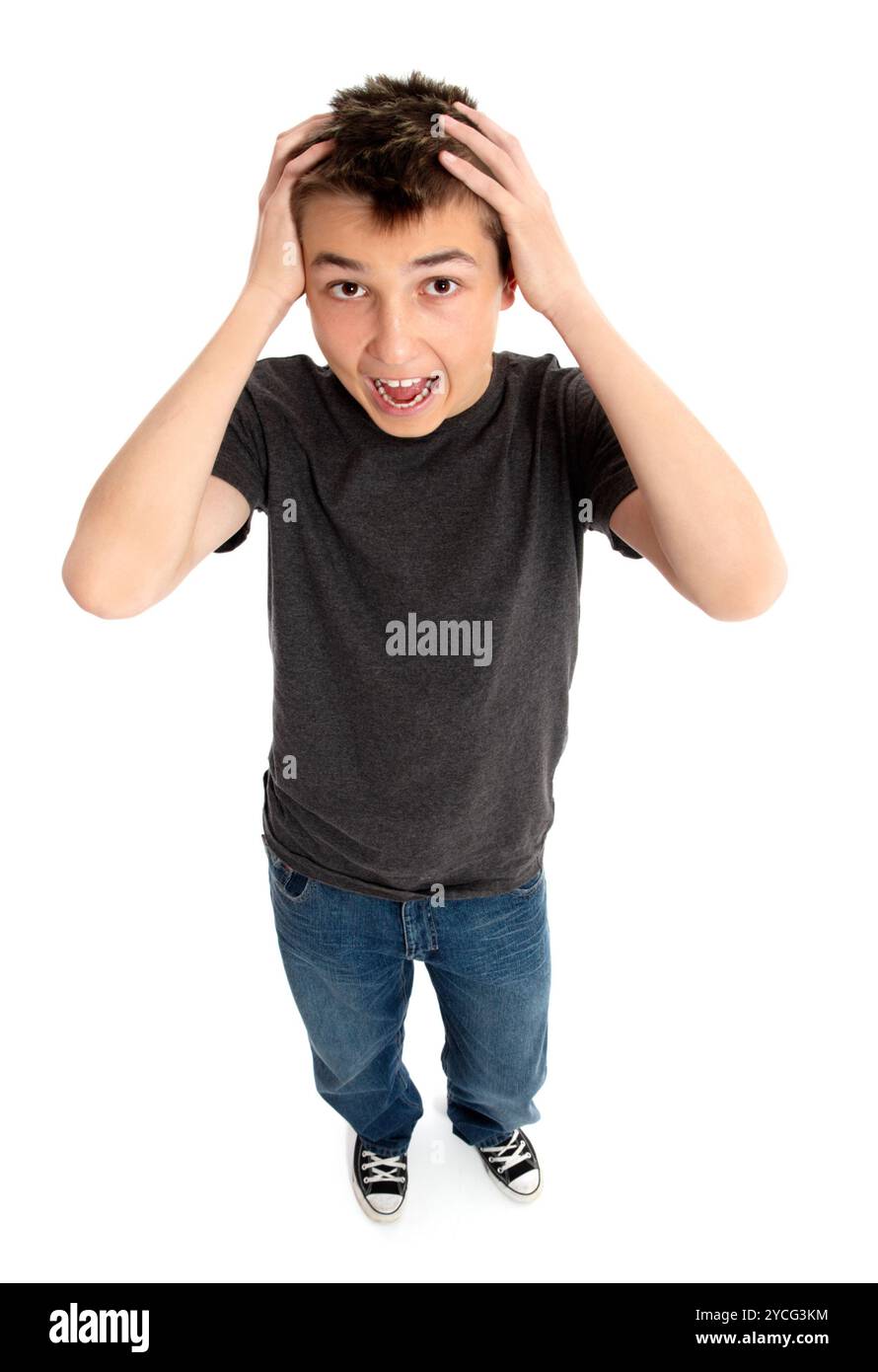 Stressed boy hands to head Stock Photo - Alamy