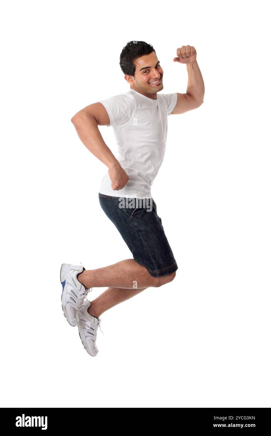 Thrilled man jumping for joy Stock Photo - Alamy