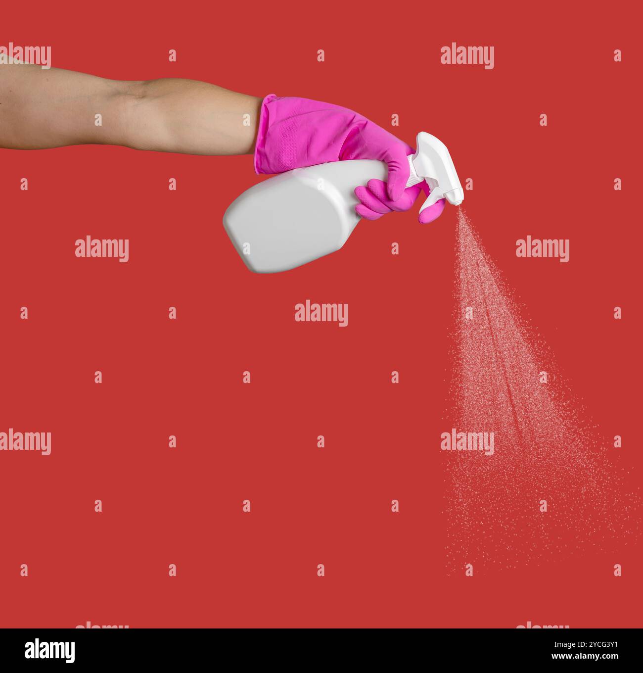 Hand in pink glove sprays detergent on red background. Banner with copy ...