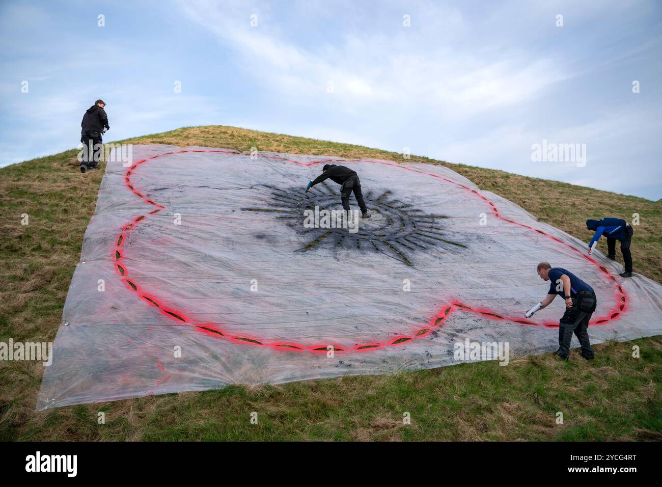 Giant poppies are painted onto the grass pyramids alongside the M8 ...