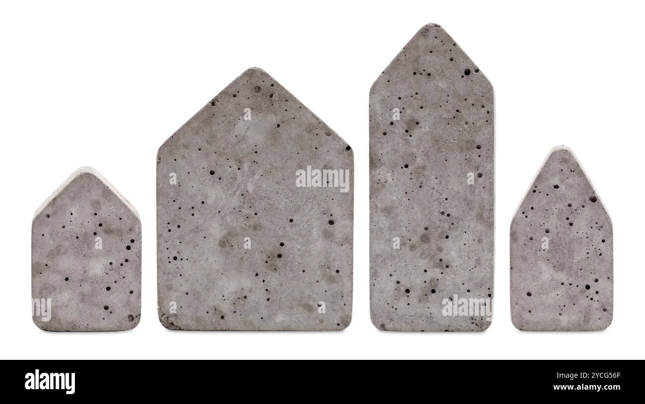 Set of minimalist concrete house-shaped blocks varying in size ...