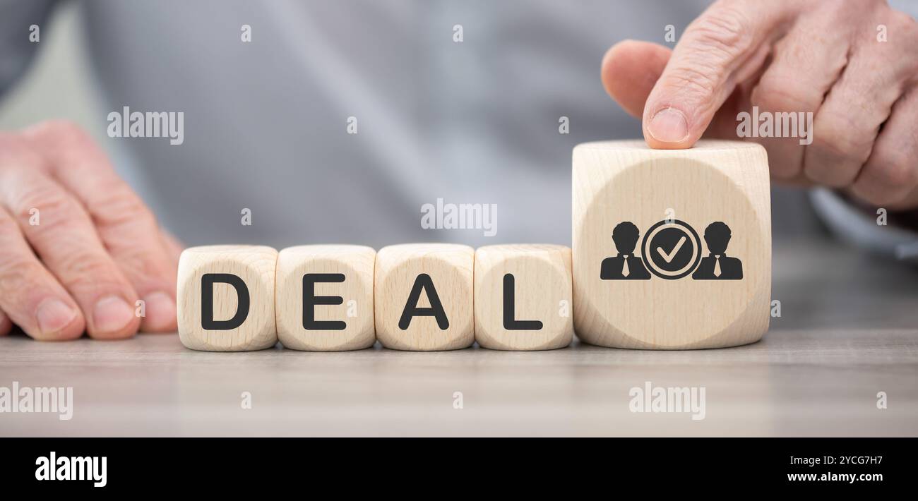 Wooden blocks with symbol of deal concept Stock Photo - Alamy