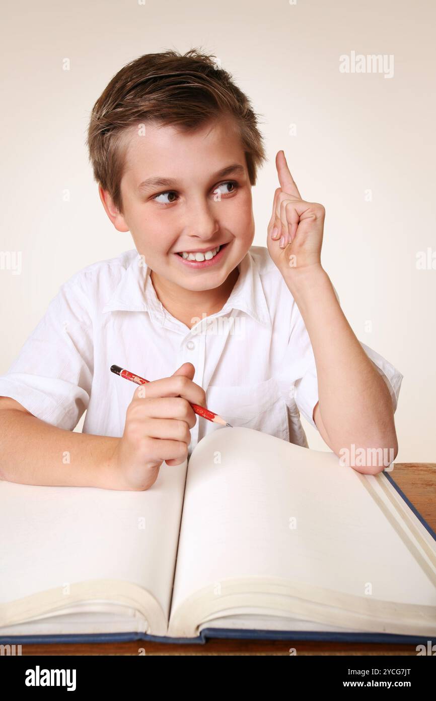 Brainchild schoolboy with idea Stock Photo - Alamy