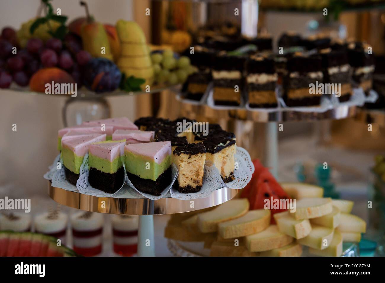 Colorful Dessert Display Featuring Layered Cakes and Fresh Fruits Stock ...