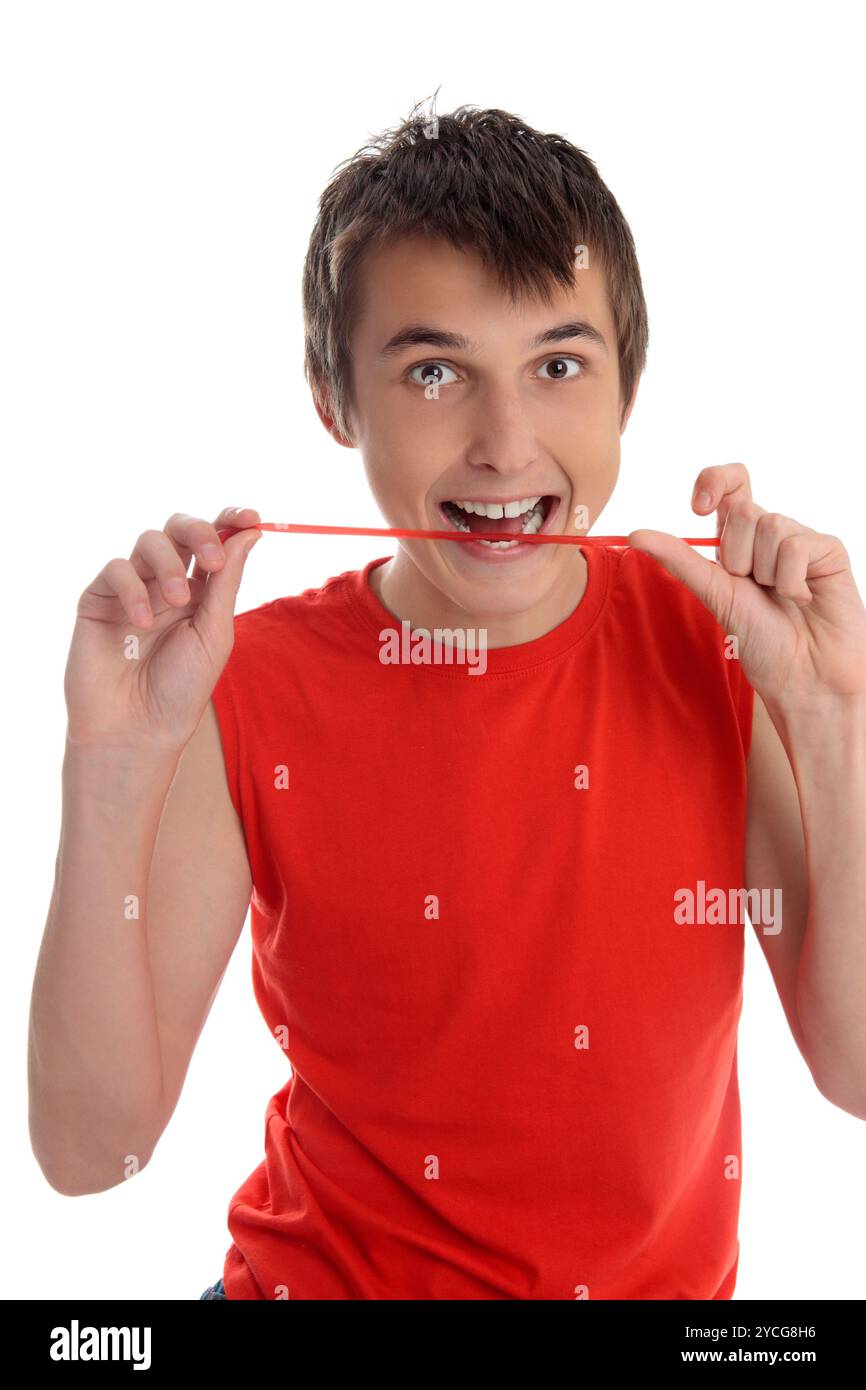 Smiling boy eating candy Stock Photo - Alamy