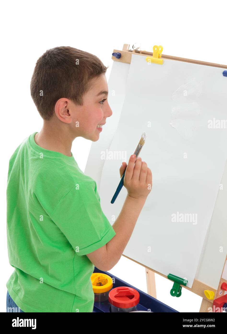 Boy reading to paint Stock Photo - Alamy