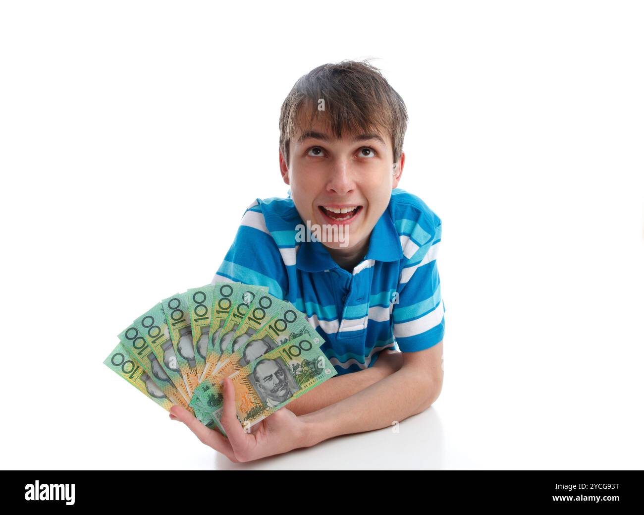 Boy with a fan of money banknotes Stock Photo - Alamy
