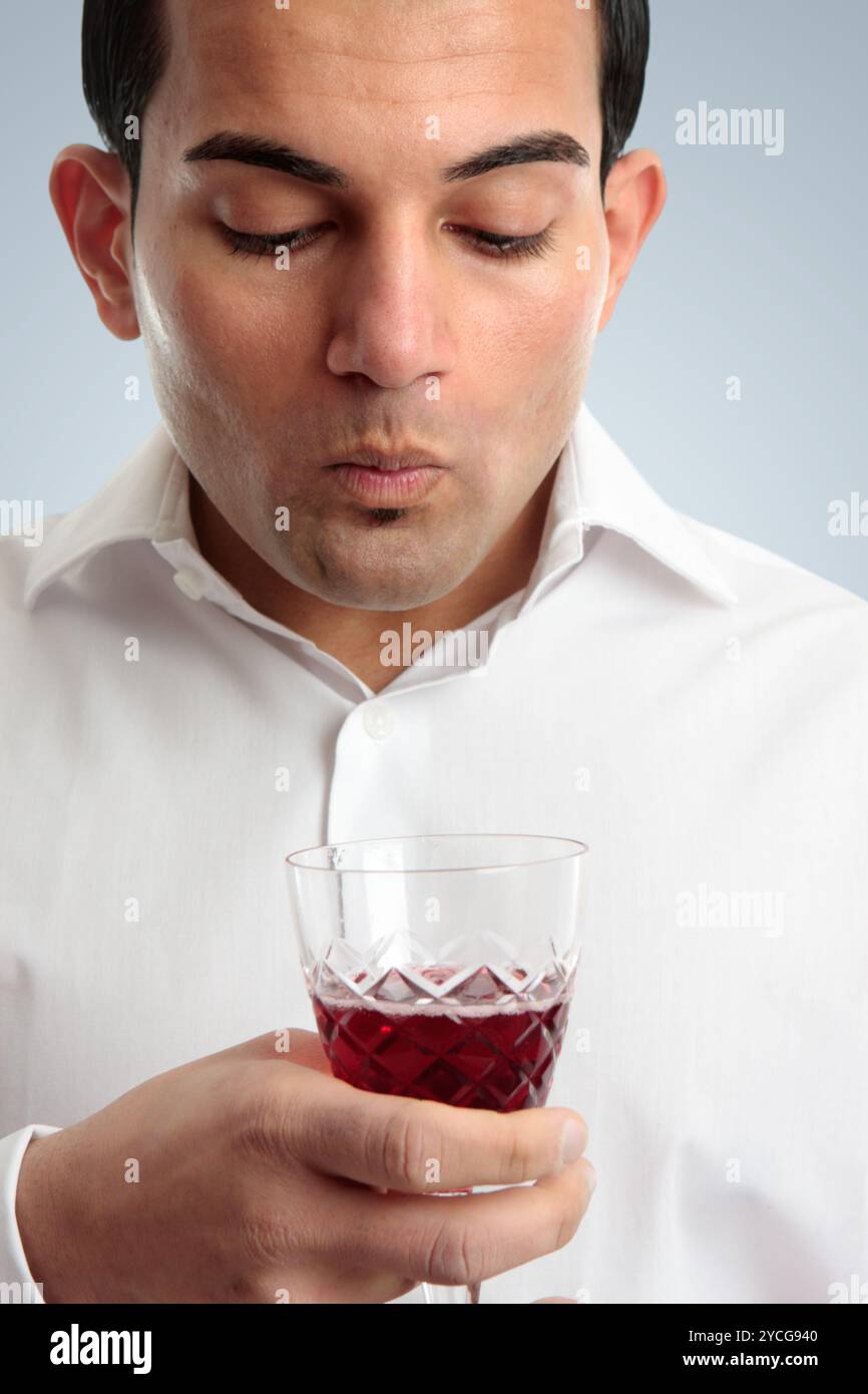 Man tasting red wine Stock Photo - Alamy