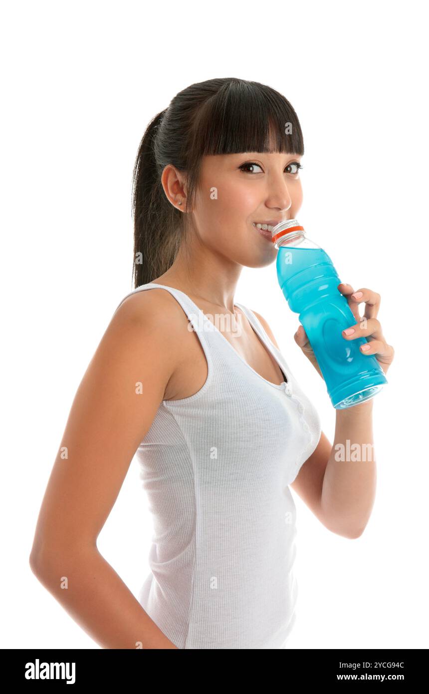 Attractive girl drinking sports drink after exercise Stock Photo - Alamy