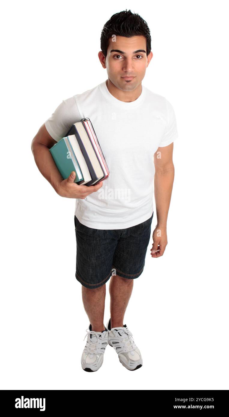 Male college student standing with textbooks under one arm Stock Photo ...