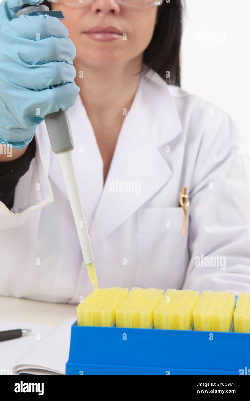 Scientist using pipette Stock Photo - Alamy