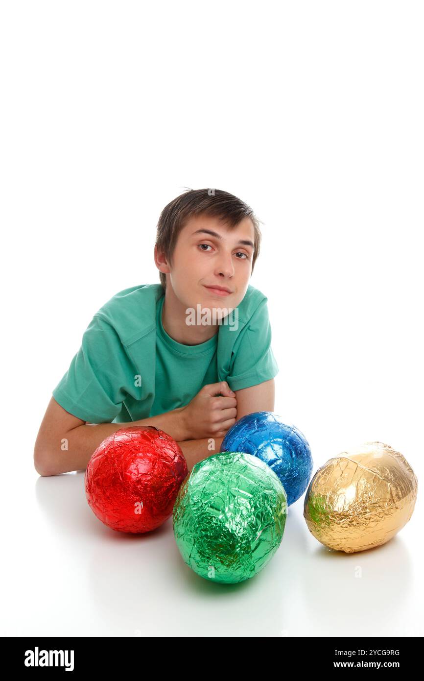 Boy with chocolate easter eggs Stock Photo - Alamy