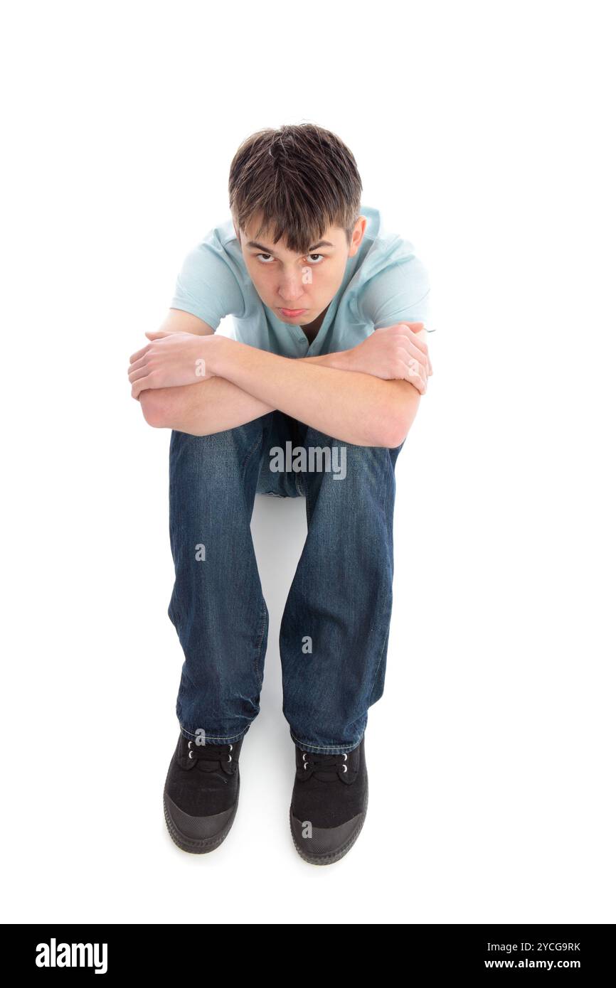 Unhappy sad boy sitting alone hi-res stock photography and images - Alamy