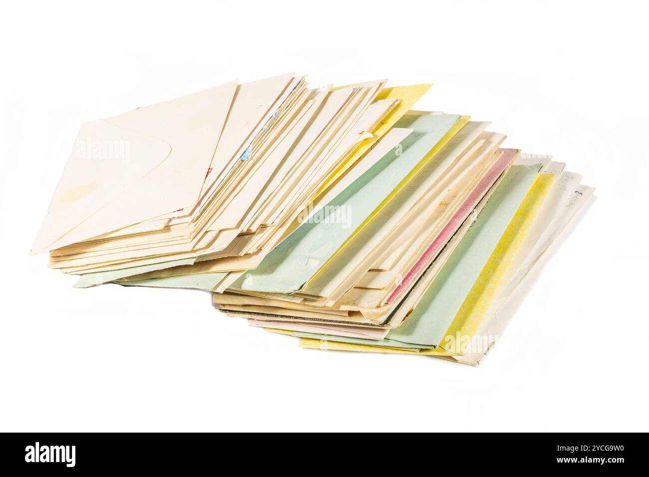 A scattered pile of old, damaged colored letters on a white background ...